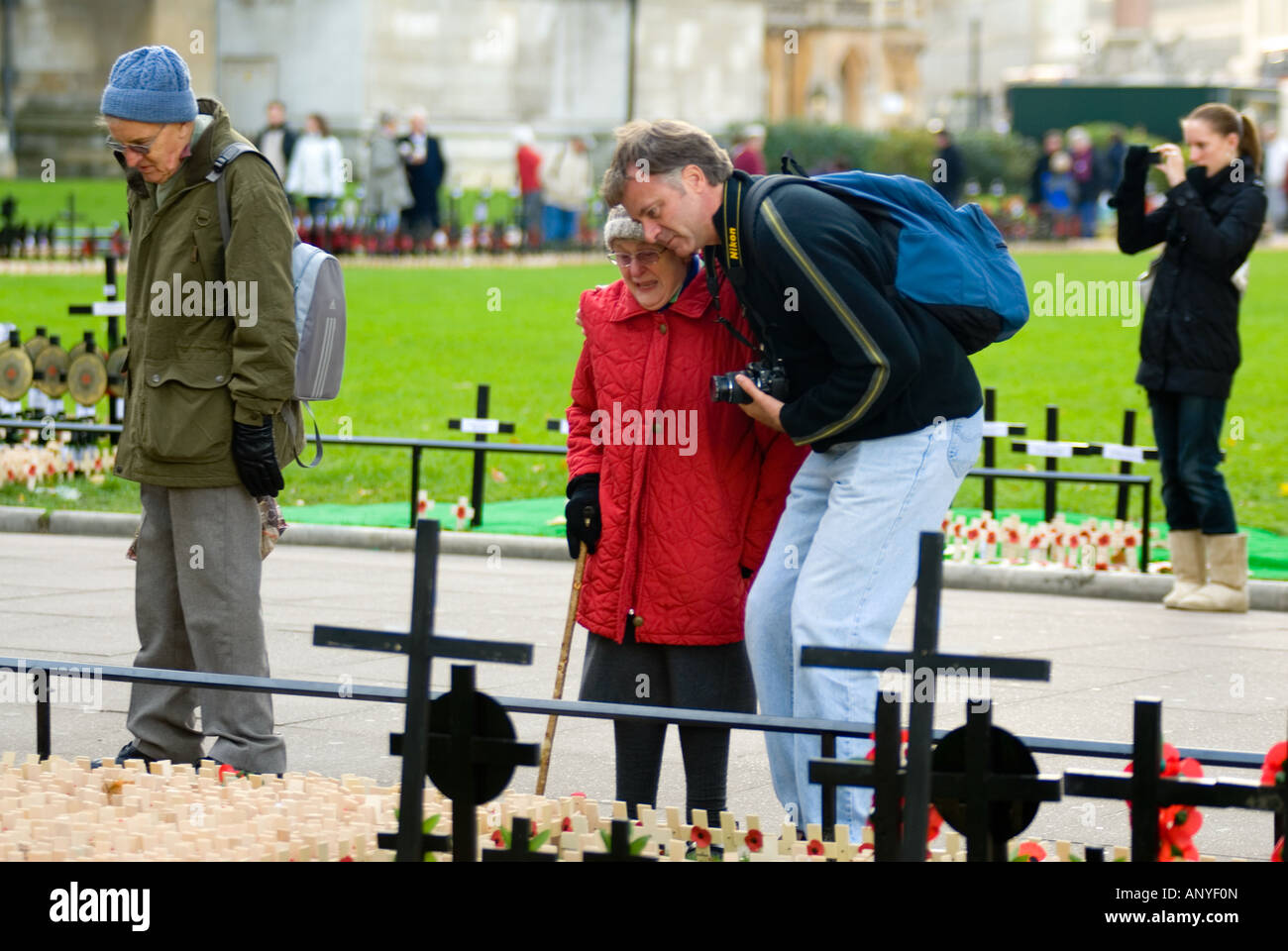 old woman crying and a man comfort Field of poppies outside Westminster ...