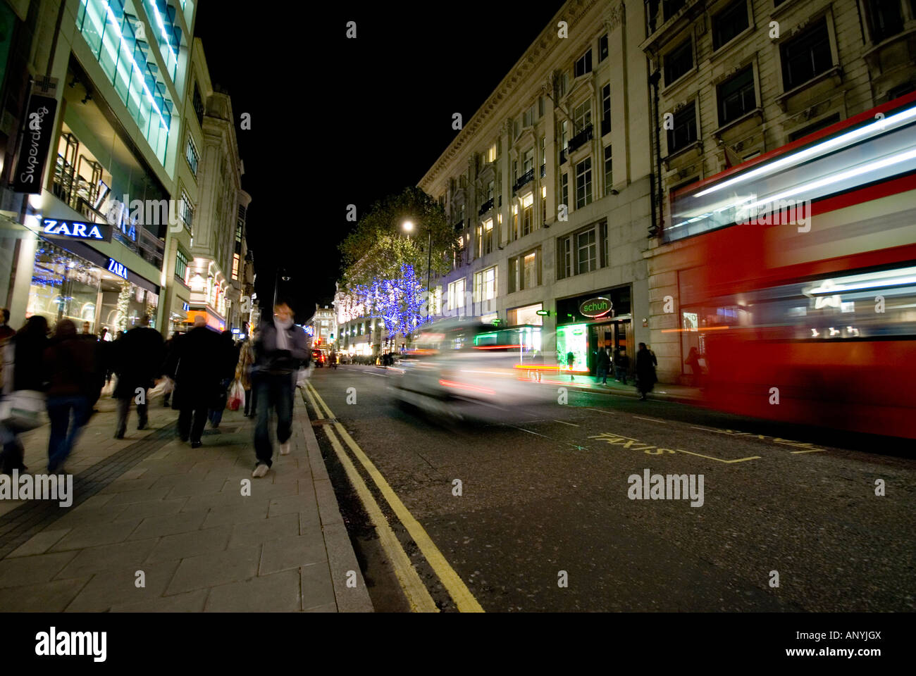 oxford street traffic light red bus by night london Stock Photo - Alamy