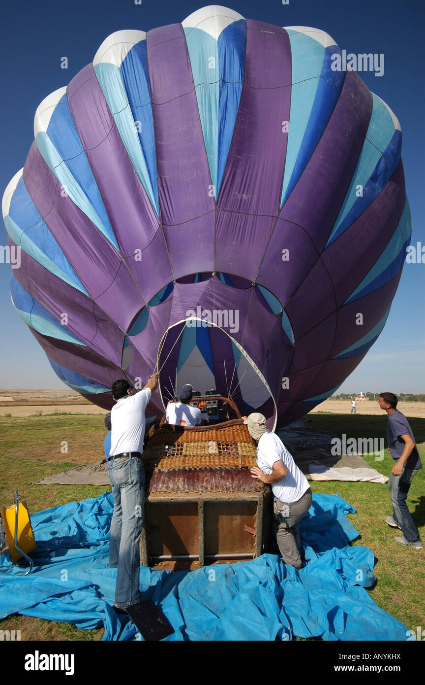 Ground crew preparing a hot air balloon before takeoff Stock Photo - Alamy