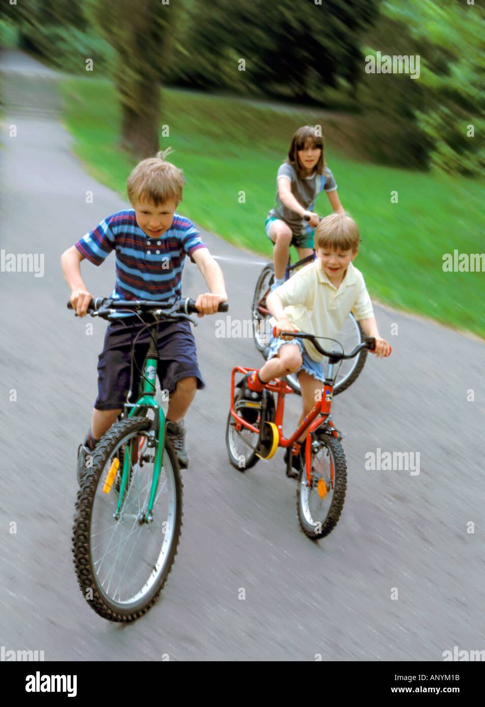 Children riding bicycles together Stock Photo - Alamy