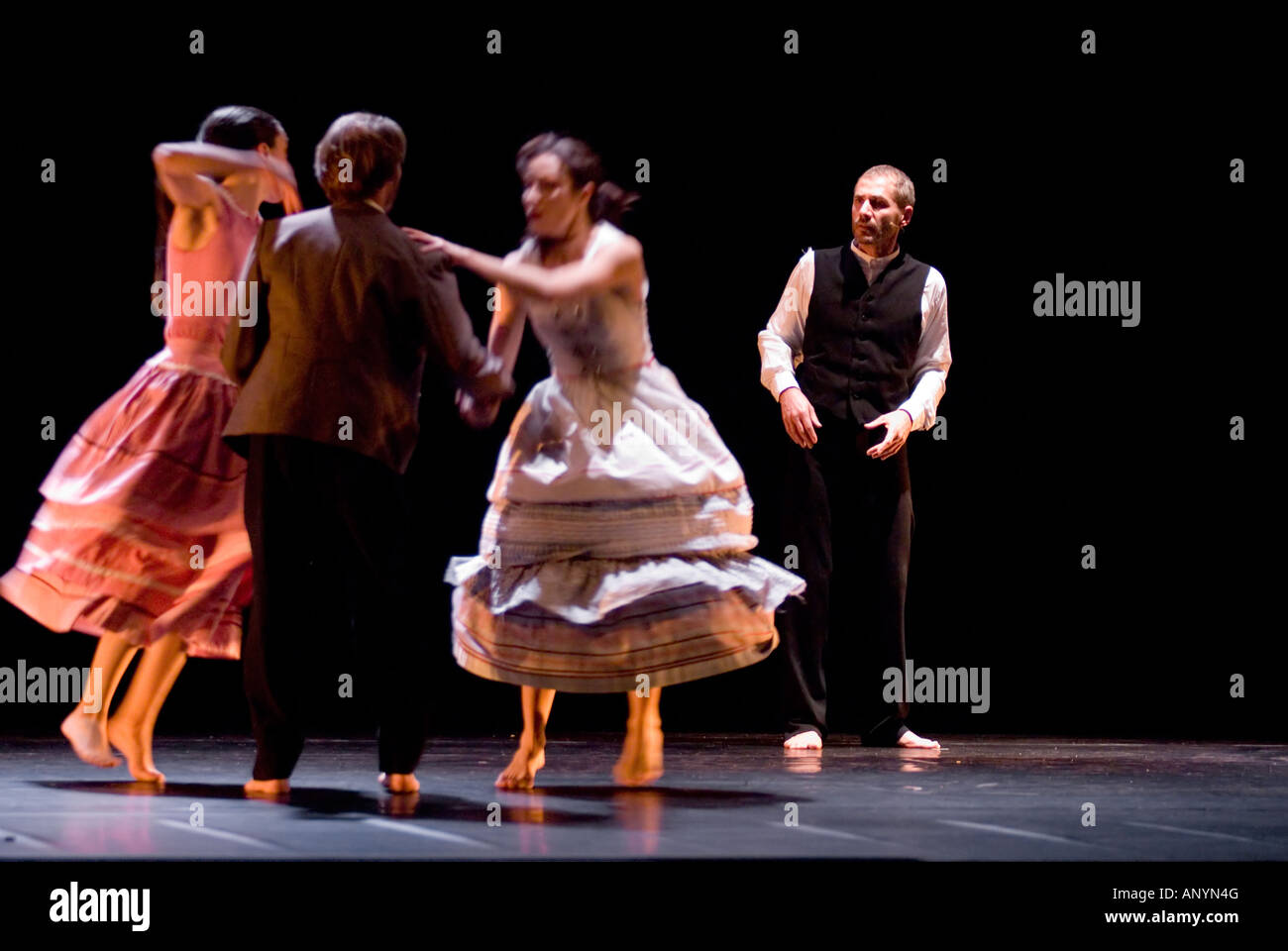 four people dancing in a theatre Stock Photo - Alamy