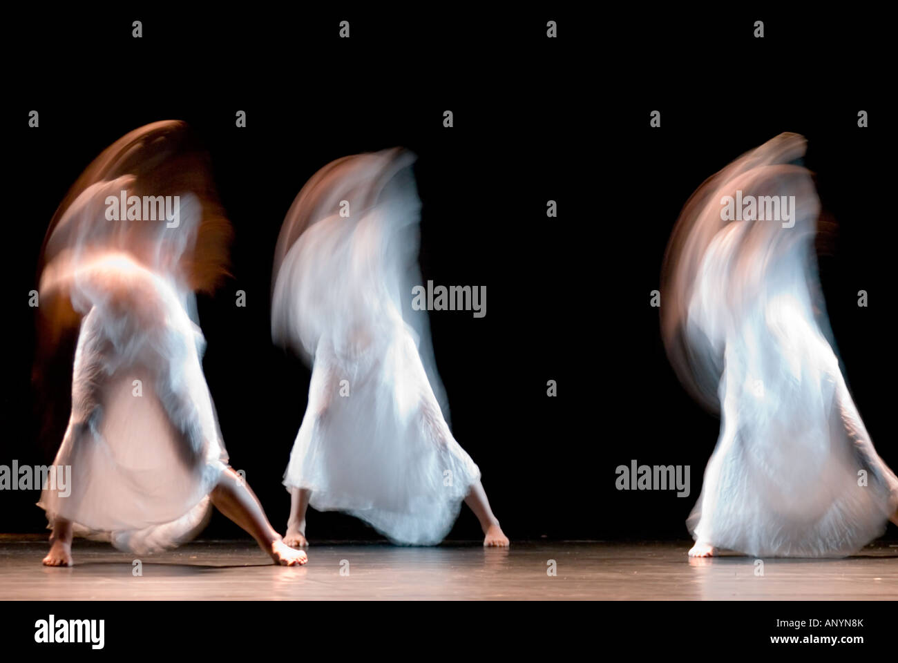 blurred motion dancing with a white dress Stock Photo - Alamy