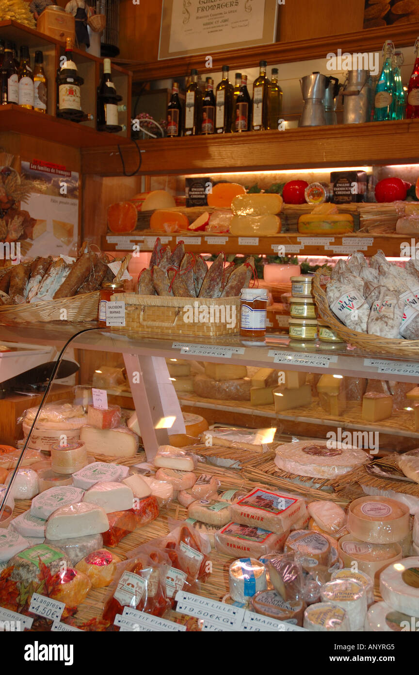 France, Paris, cheese, sausage and wine for sale in cheese shop Stock ...