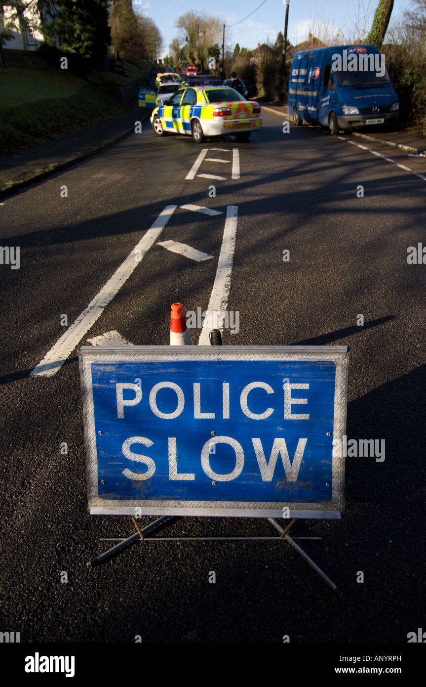 Road traffic accident with Police Slow sign, England Stock Photo - Alamy