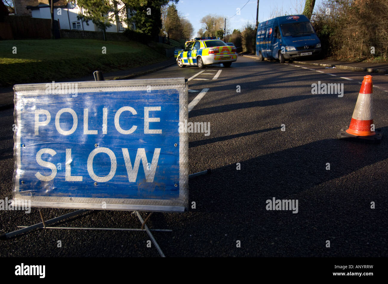 Road traffic accident with Police Slow sign, England Stock Photo - Alamy
