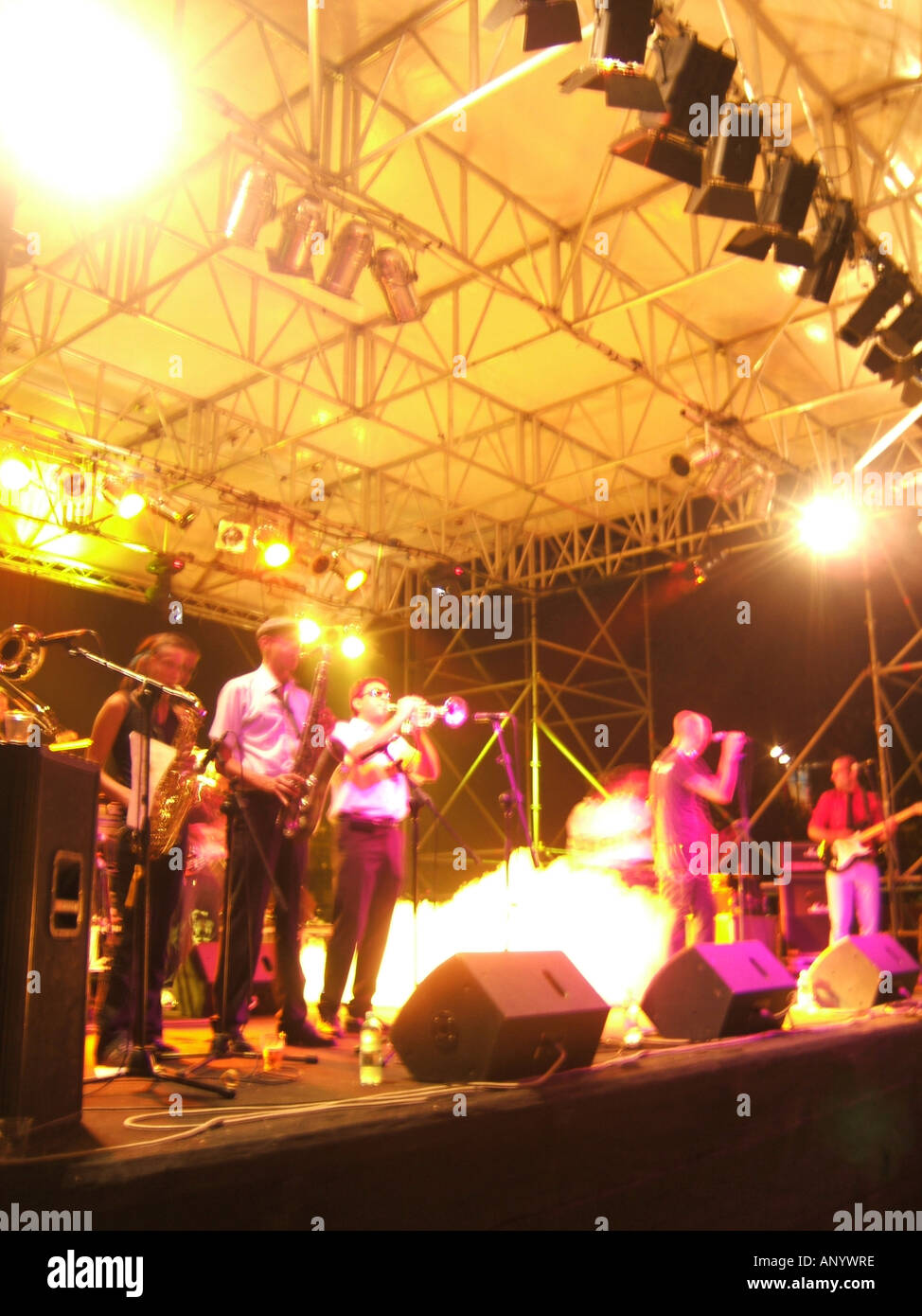 music band playing in open air gig at night Stock Photo - Alamy