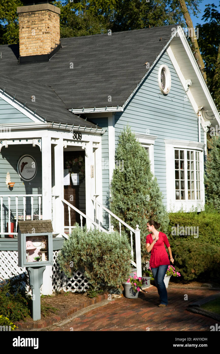 ILLINOIS Long Grove Female shopper walking outside retail store in ...