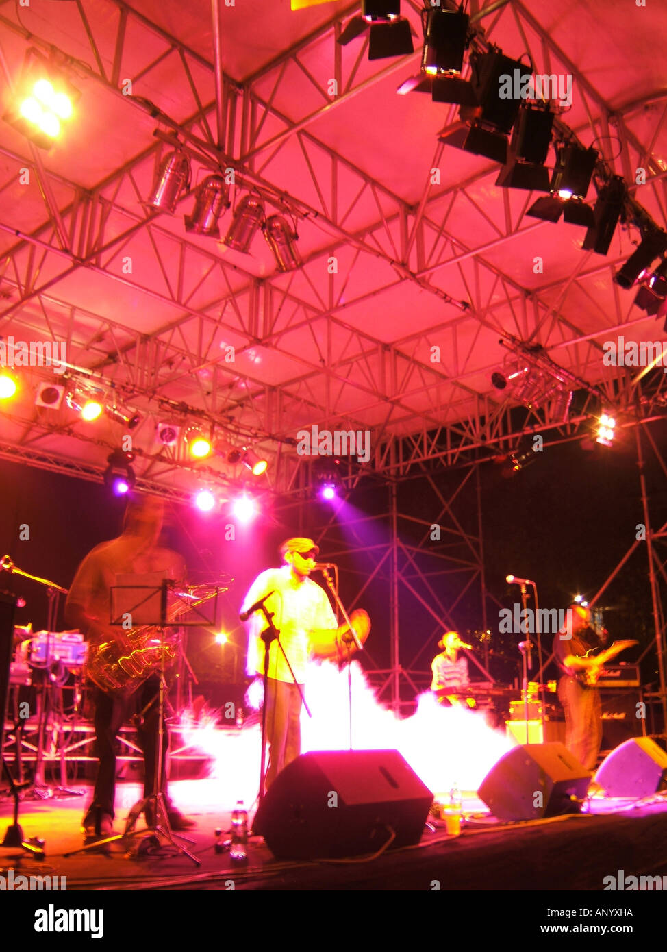 band playing in open air gig at night Stock Photo - Alamy