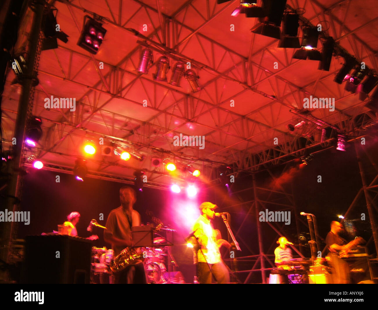 band playing in open air gig at night Stock Photo - Alamy
