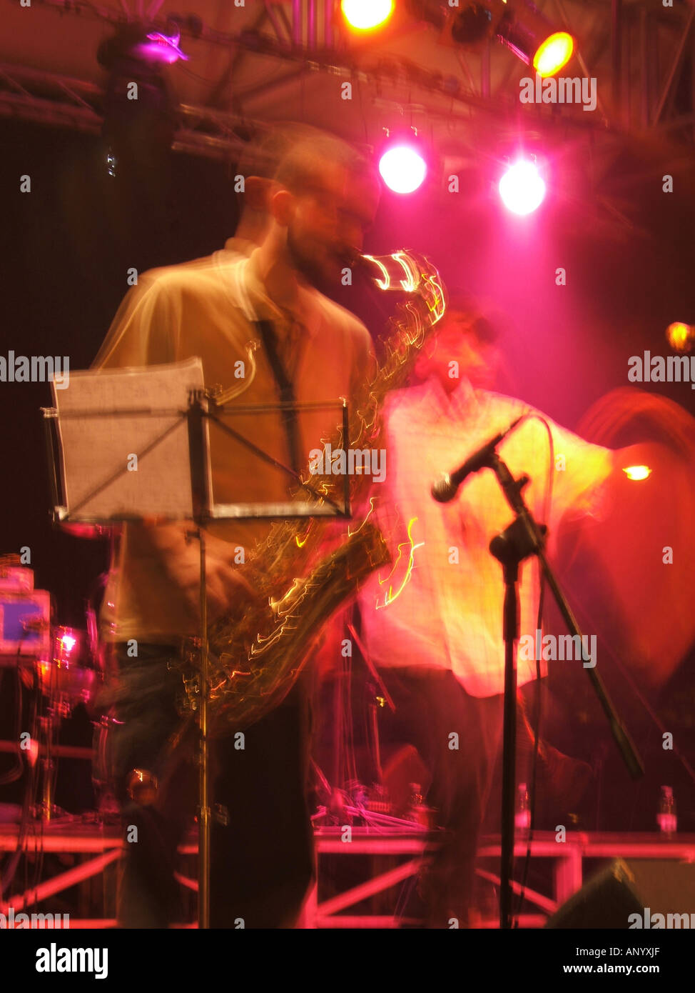 band playing in open air gig at night Stock Photo - Alamy