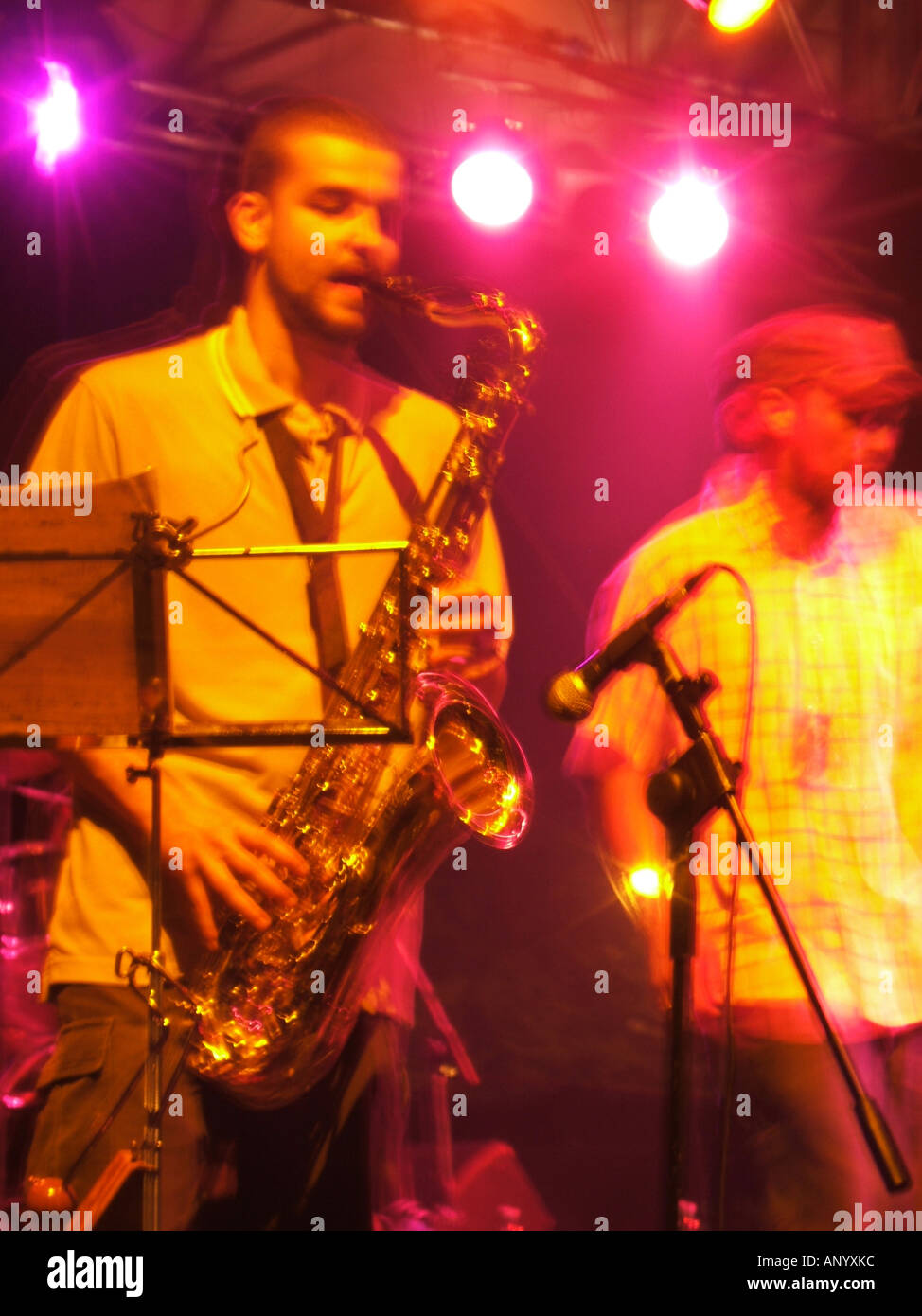 band playing in open air concert gig at night Stock Photo - Alamy