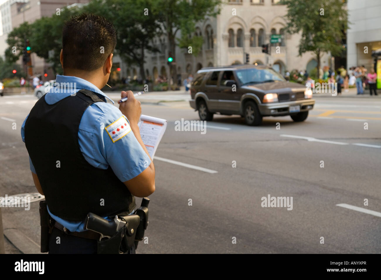 ILLINOIS Chicago Male police office standing traffic on Michigan Avenue ...