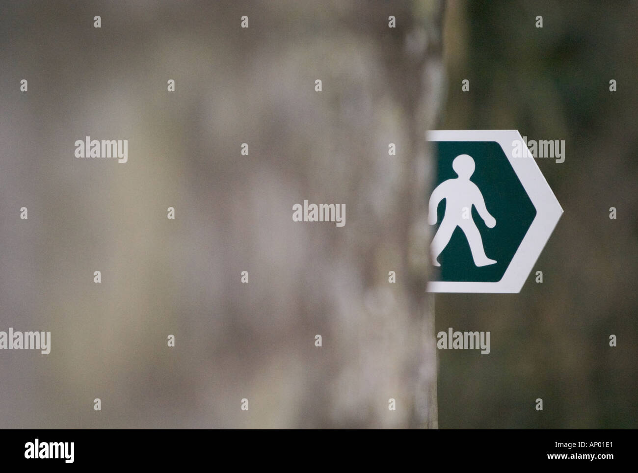 Footpath sign UK obscured by wall Stock Photo - Alamy