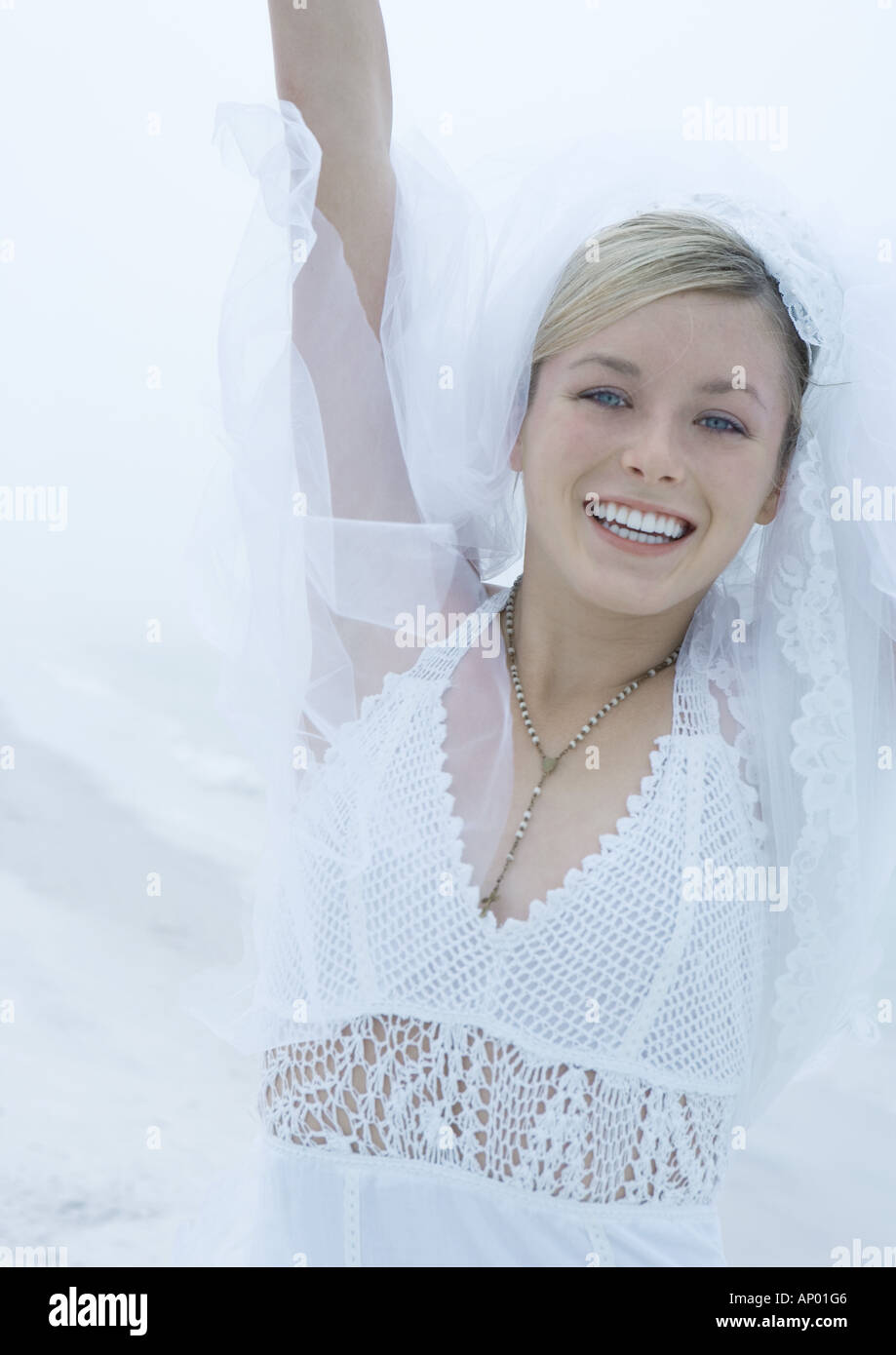 Bride reaching into air Stock Photo - Alamy