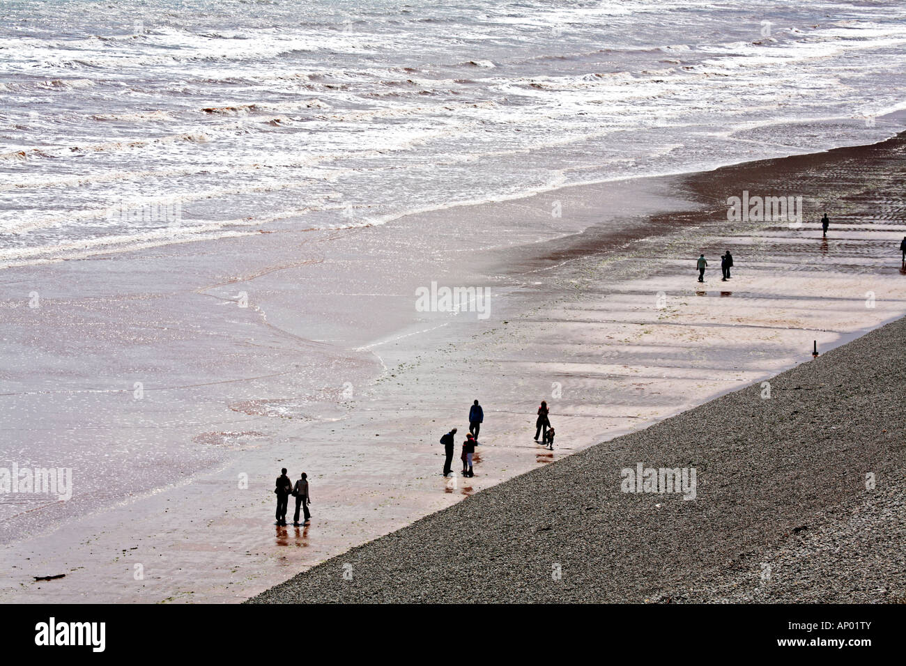 BEACH WALKERS JACOB'S LADDER BAY SIDMOUTH ENGLAND Stock Photo - Alamy