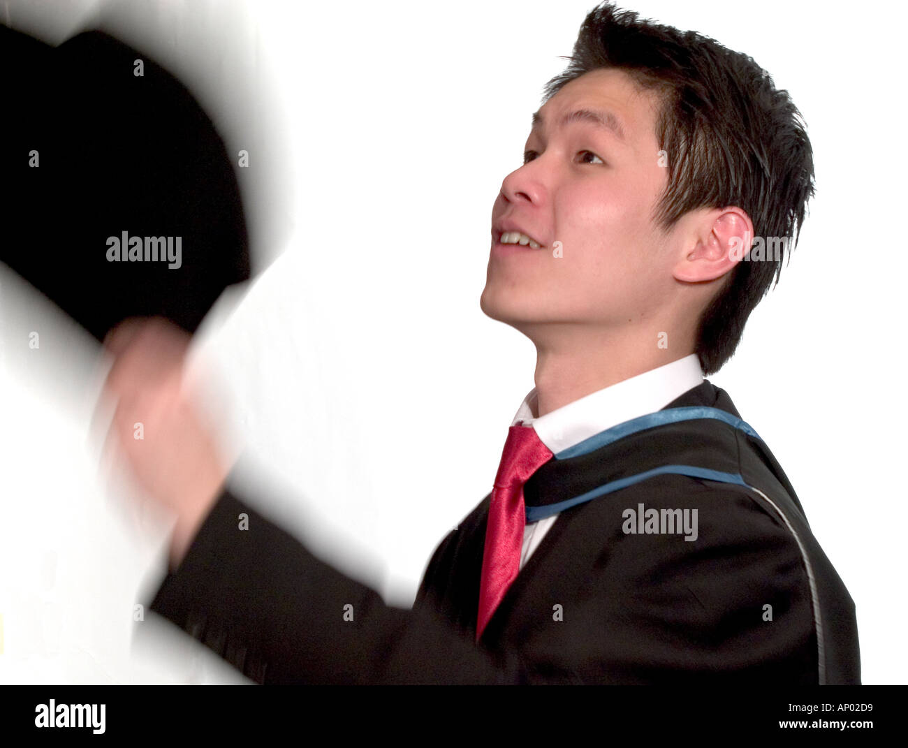 Malaysian Graduate throwing hat up into air Slight motion blur Stock ...