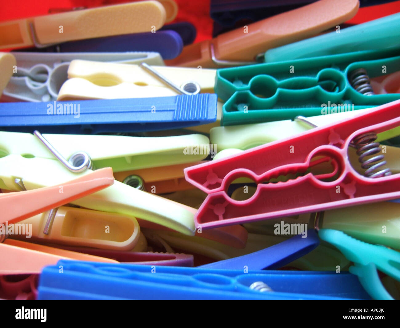 box full of plastic clothes pegs clips Stock Photo - Alamy