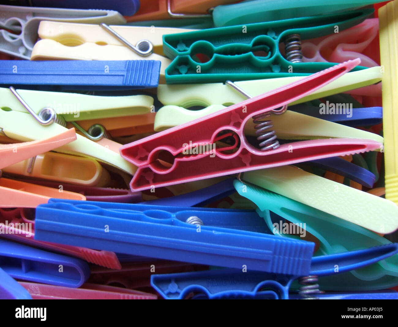 box full of plastic clothes pegs clips Stock Photo - Alamy