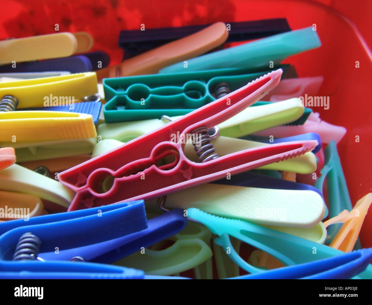 box full of plastic clothes pegs clips Stock Photo - Alamy
