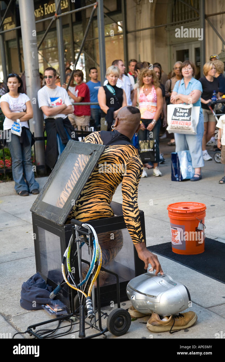 ILLINOIS Chicago Adult male street performer on Michigan Avenue climb ...