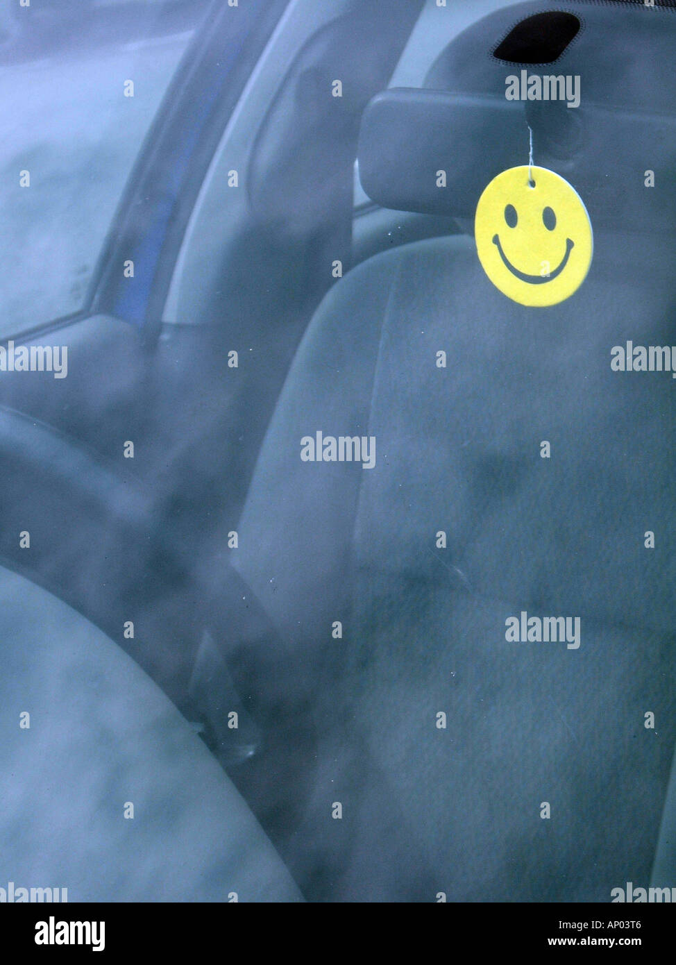 hanging smiley face sticker in car Stock Photo - Alamy