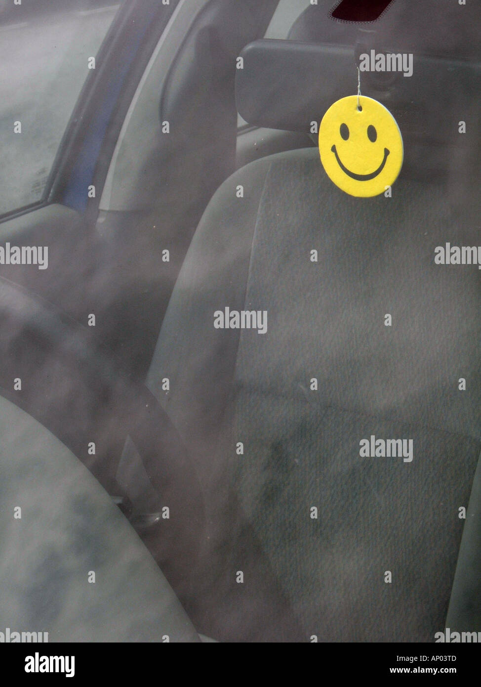 hanging smiley face sticker in car Stock Photo - Alamy