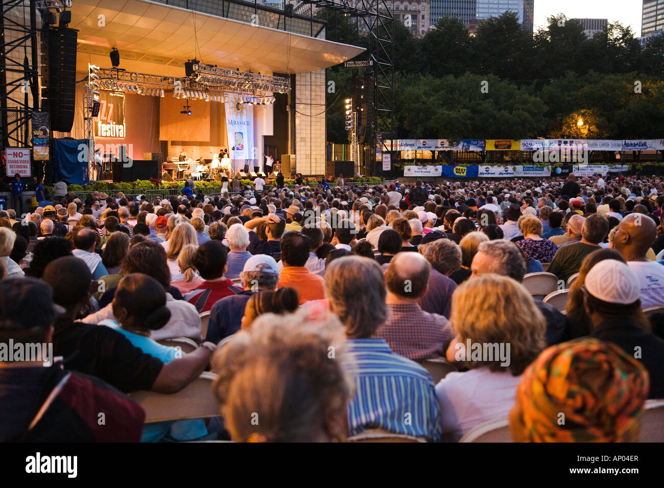 ILLINOIS Chicago Crowd of people sitting in Grant Park Petrillo outdoor ...