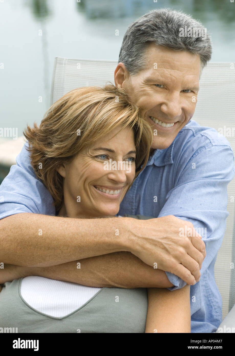 Woman and arms around man from behind hi-res stock photography and ...