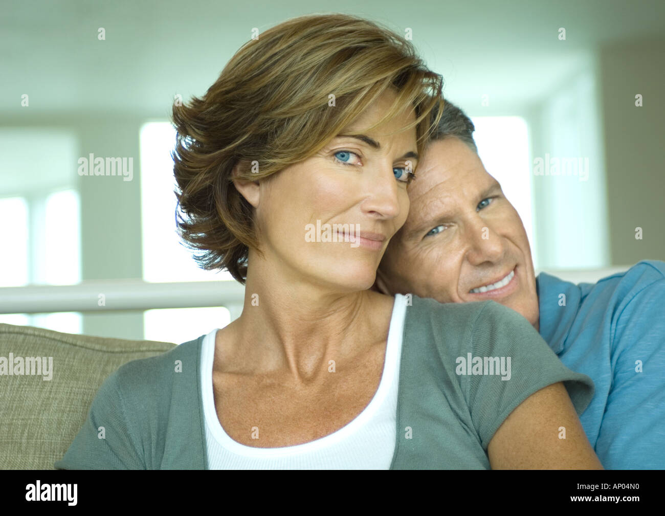 Mature couple, man resting head on woman's shoulder Stock Photo - Alamy