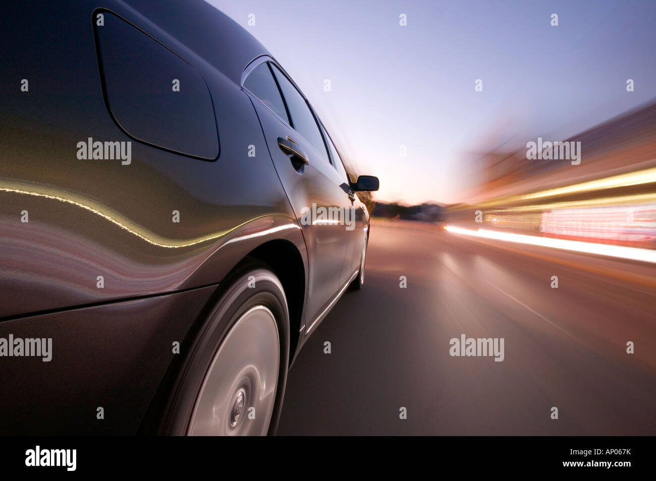 Driving down a city street at night from outside the car Stock Photo ...