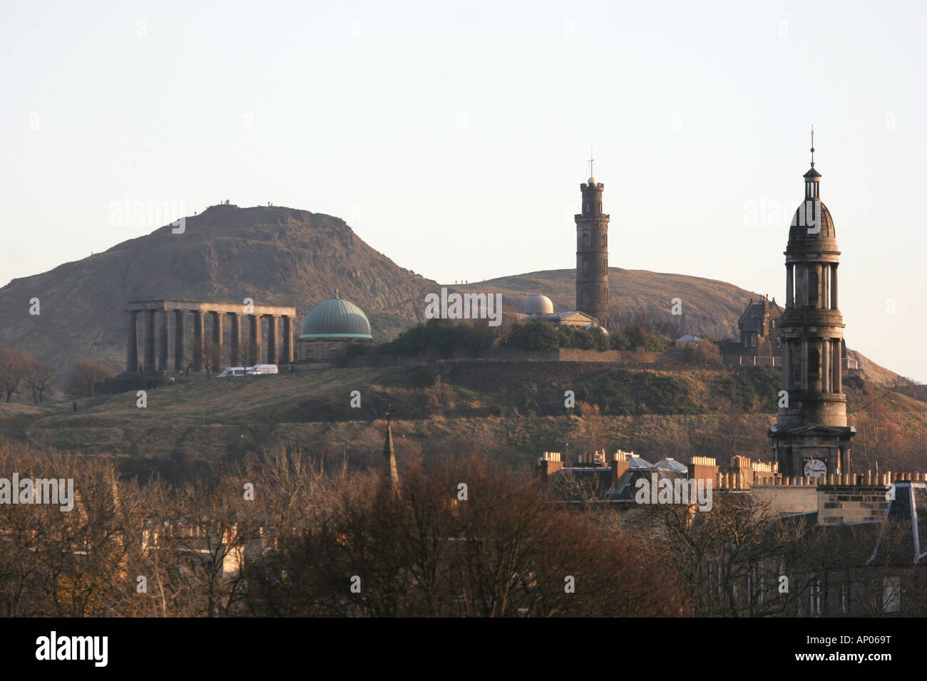 A view of Arthur's Seat across Calton Hill in Edinburgh at sunset Stock ...
