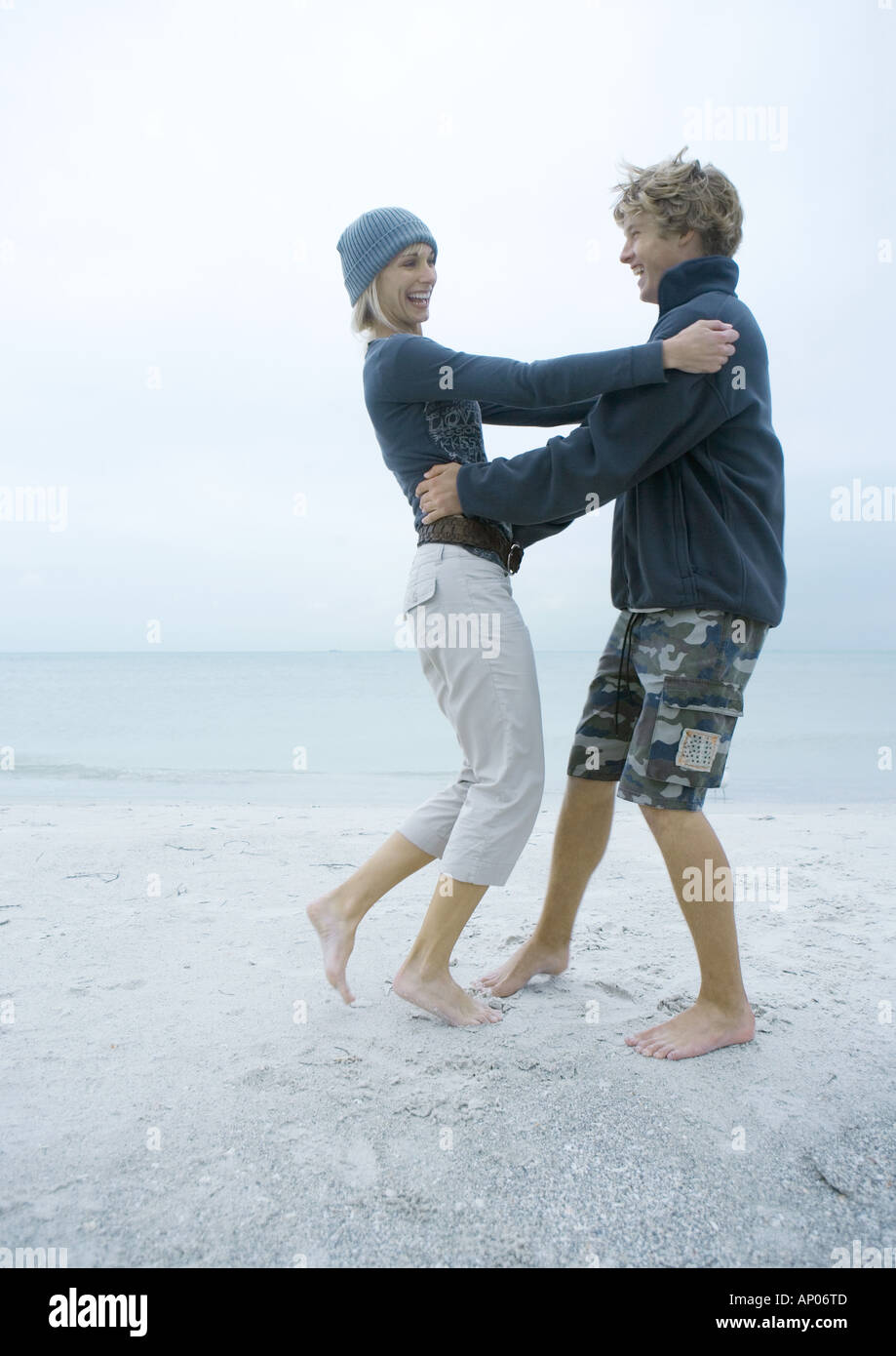 Young couple dancing on beach Stock Photo - Alamy