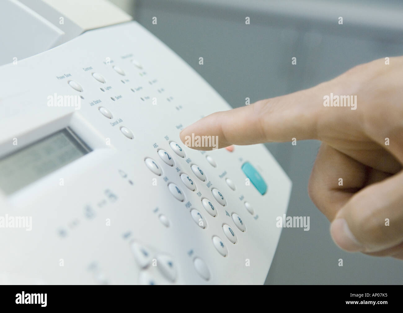 Man's finger about to push button on fax machine Stock Photo - Alamy