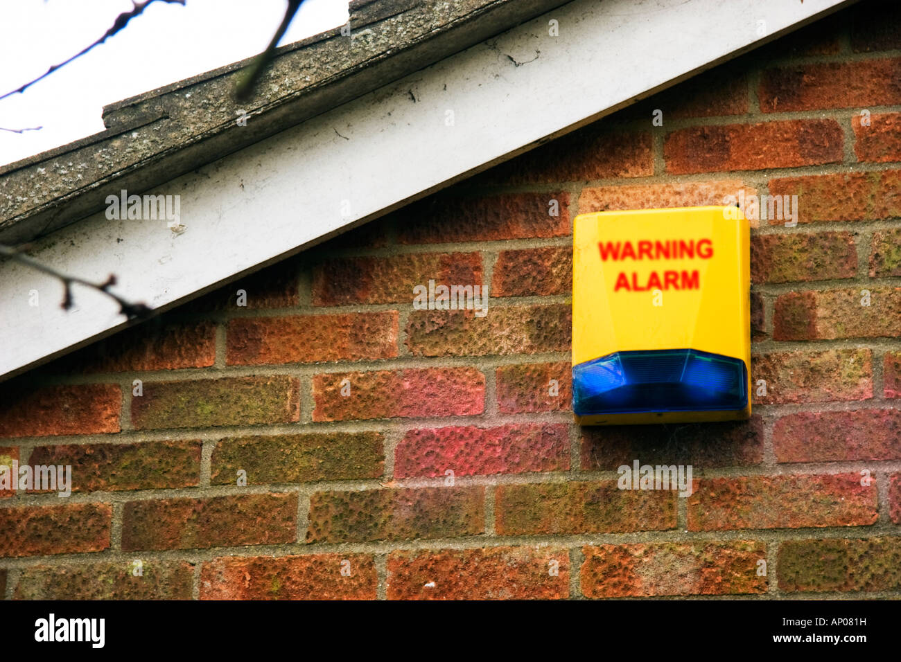 Burglar alarm with flashing lights on a wall Stock Photo - Alamy