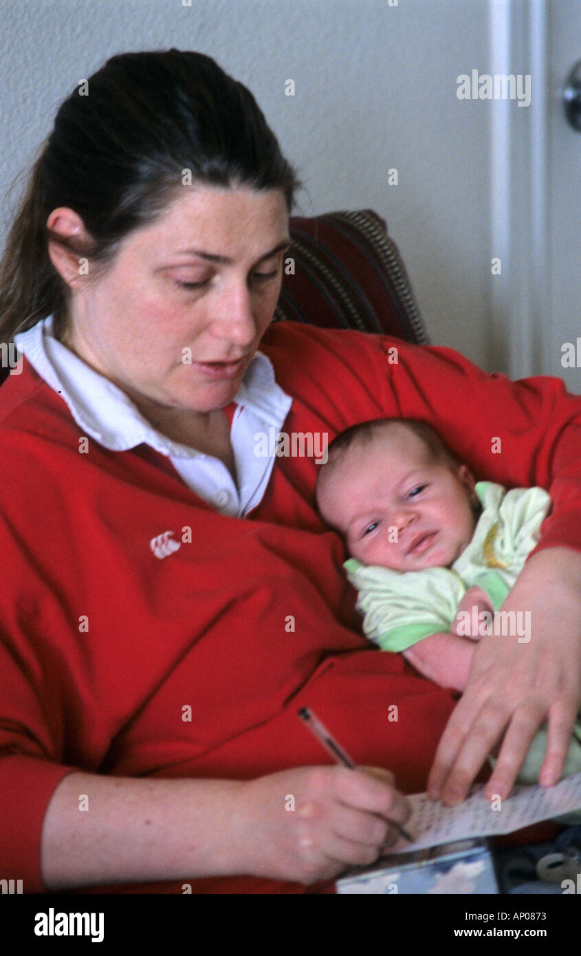 New mother working from home Stock Photo - Alamy