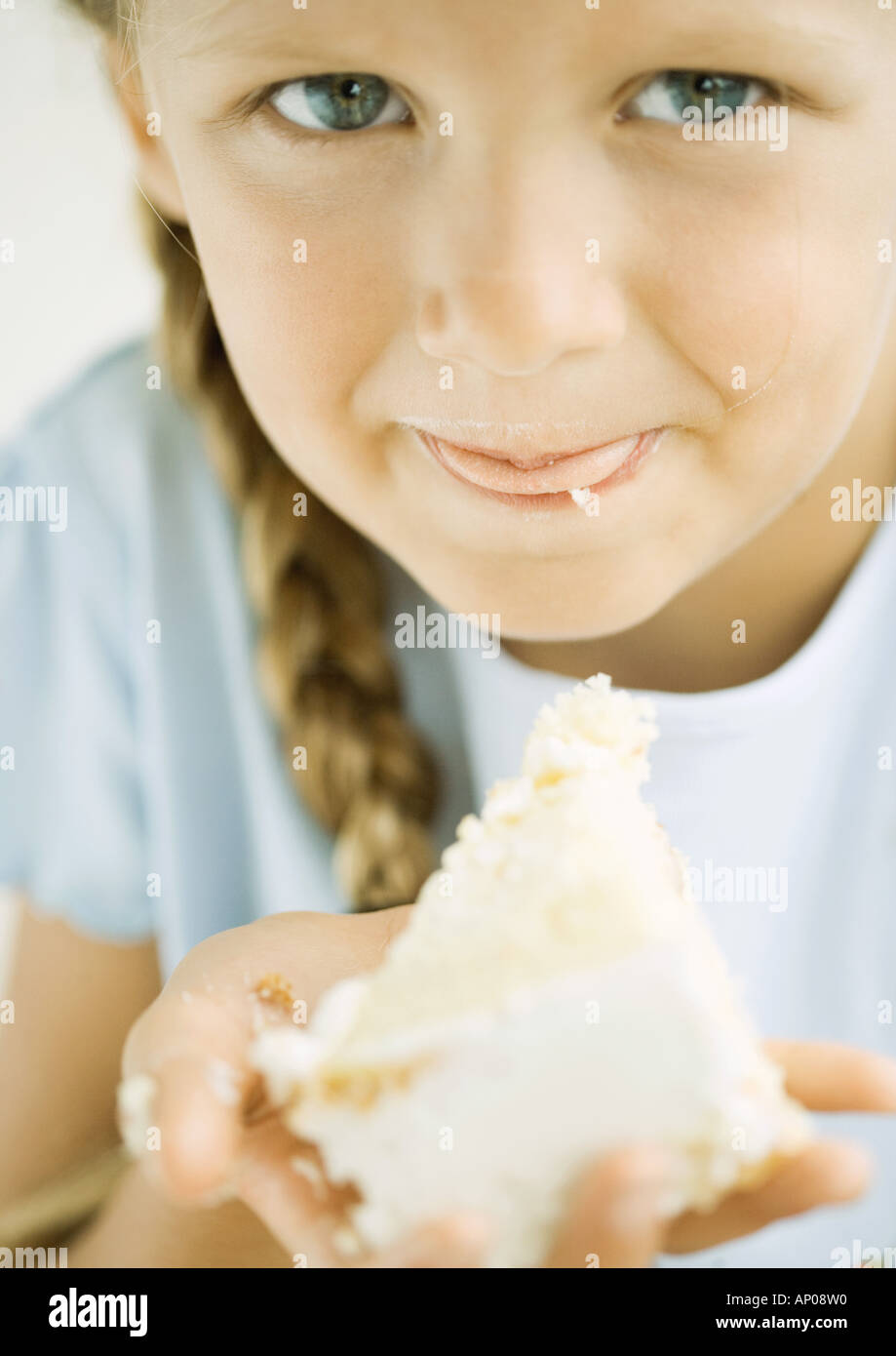 Girl eating cake Stock Photo - Alamy