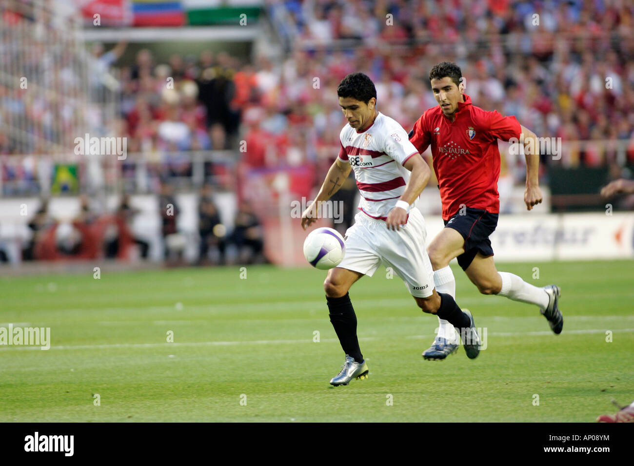 Renato with the ball pursued by an opponent player Stock Photo - Alamy