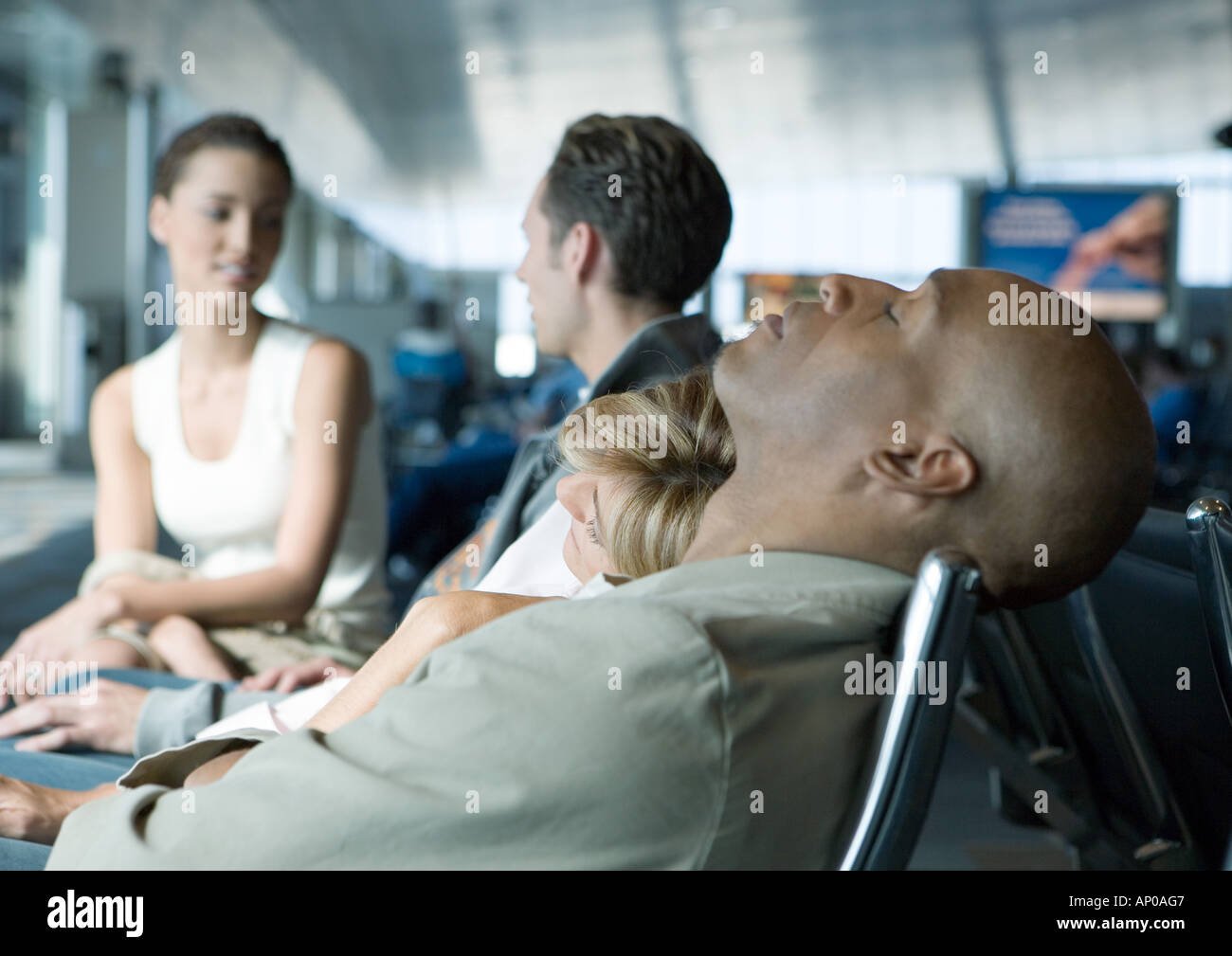 People in airport lounge Stock Photo - Alamy