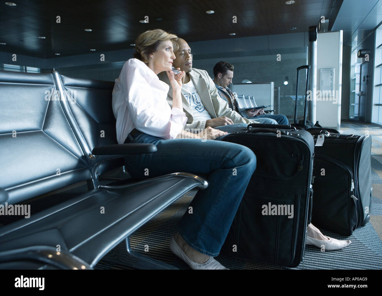 People in airport lounge Stock Photo - Alamy