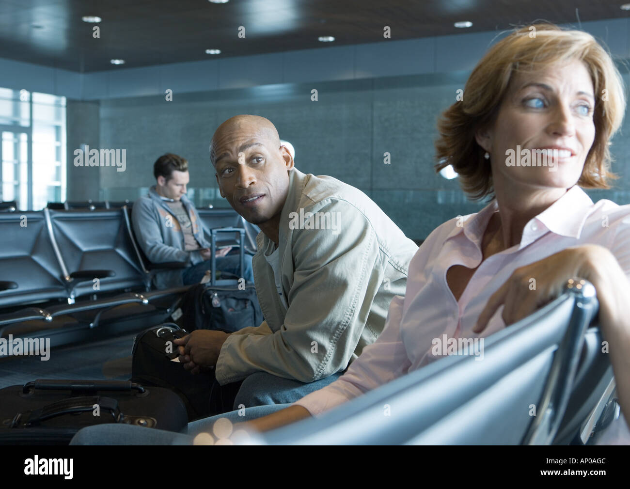 People in airport lounge Stock Photo - Alamy