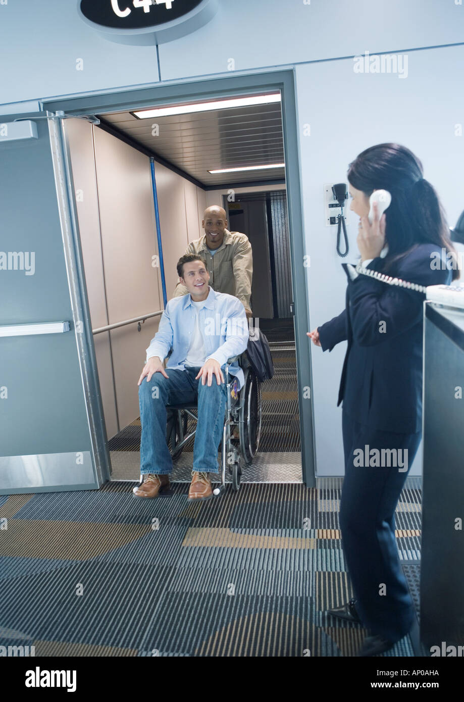 Traveler in wheelchair arriving at gate in airport Stock Photo - Alamy Traveler in wheelchair arriving at gate in airport Stock Photo - Alamy