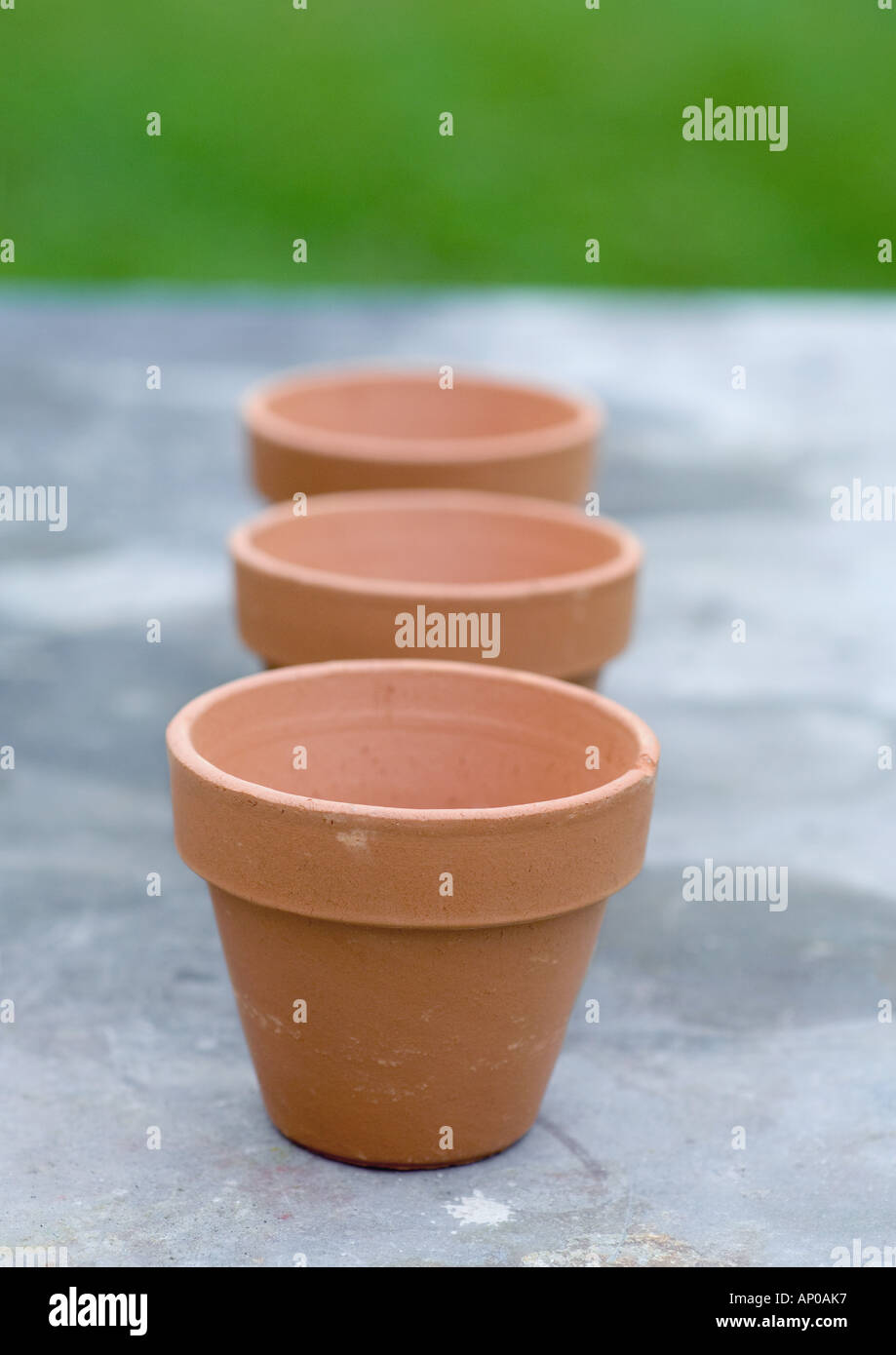 Three terracotta pots Stock Photo - Alamy
