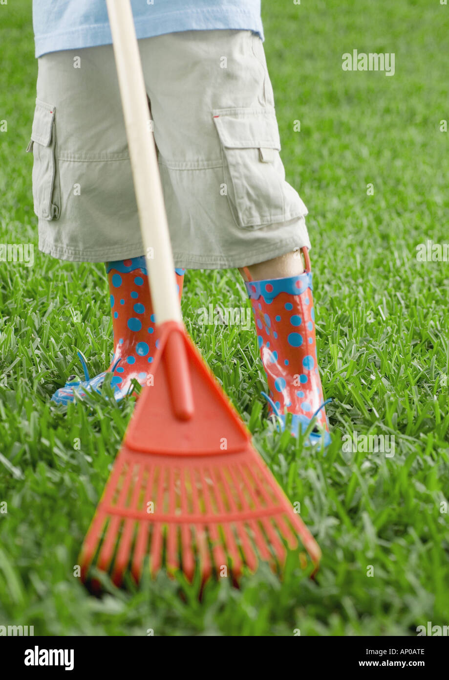 Children gardening with rake hi-res stock photography and images - Alamy