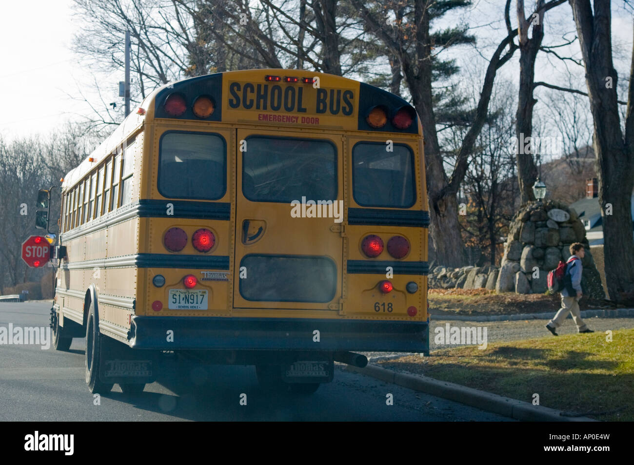 Child getting off a school bus Stock Photo - Alamy