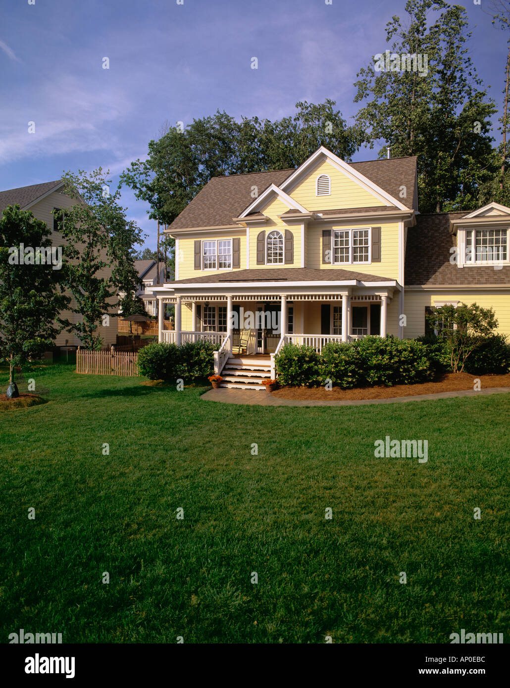 Large Two Story Yellow House with Black Shutters a Large Lawn Porch ...
