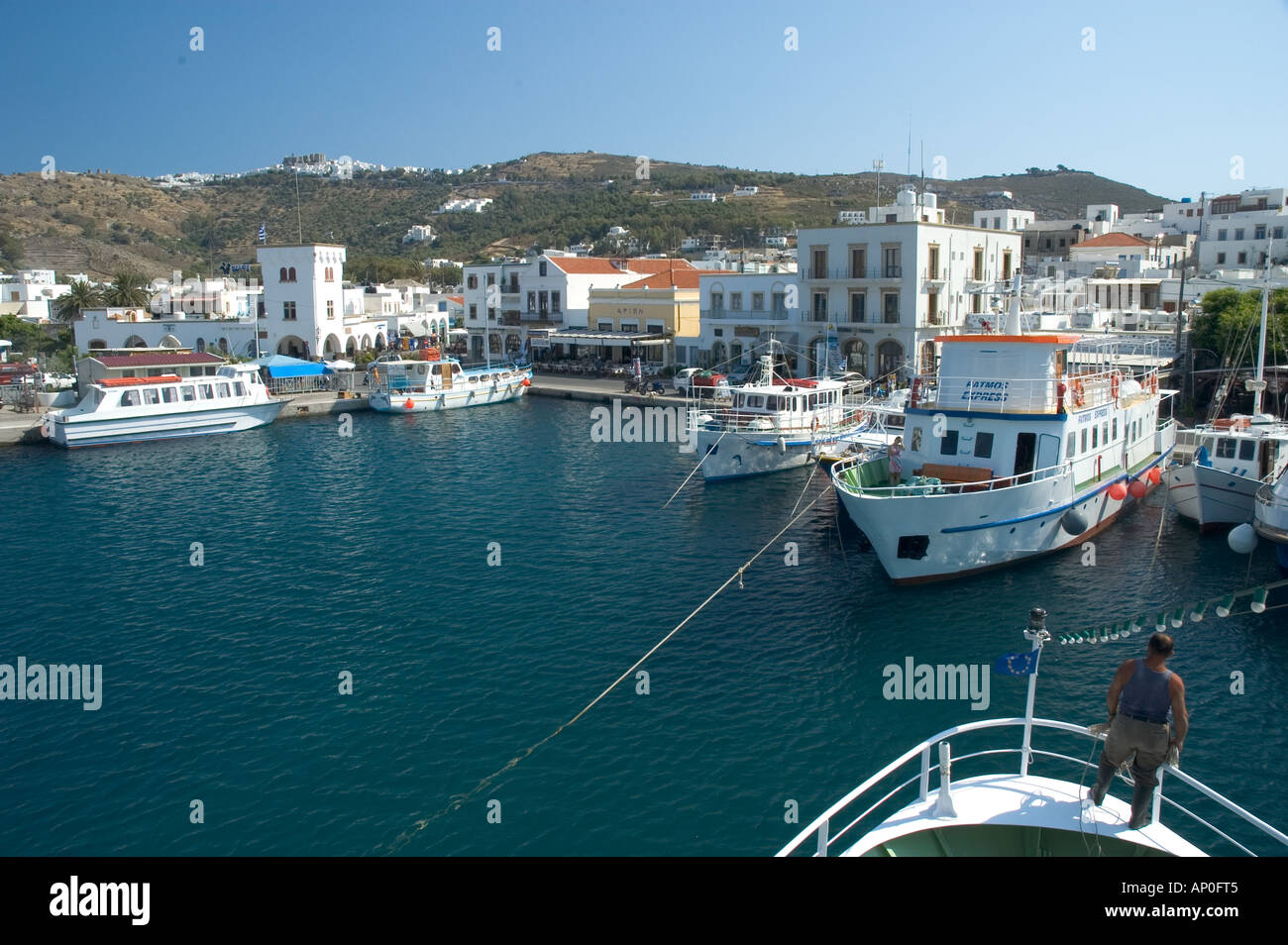 Europe, Greece, Dodecanese, Patmos: arriving by caique at the port of ...