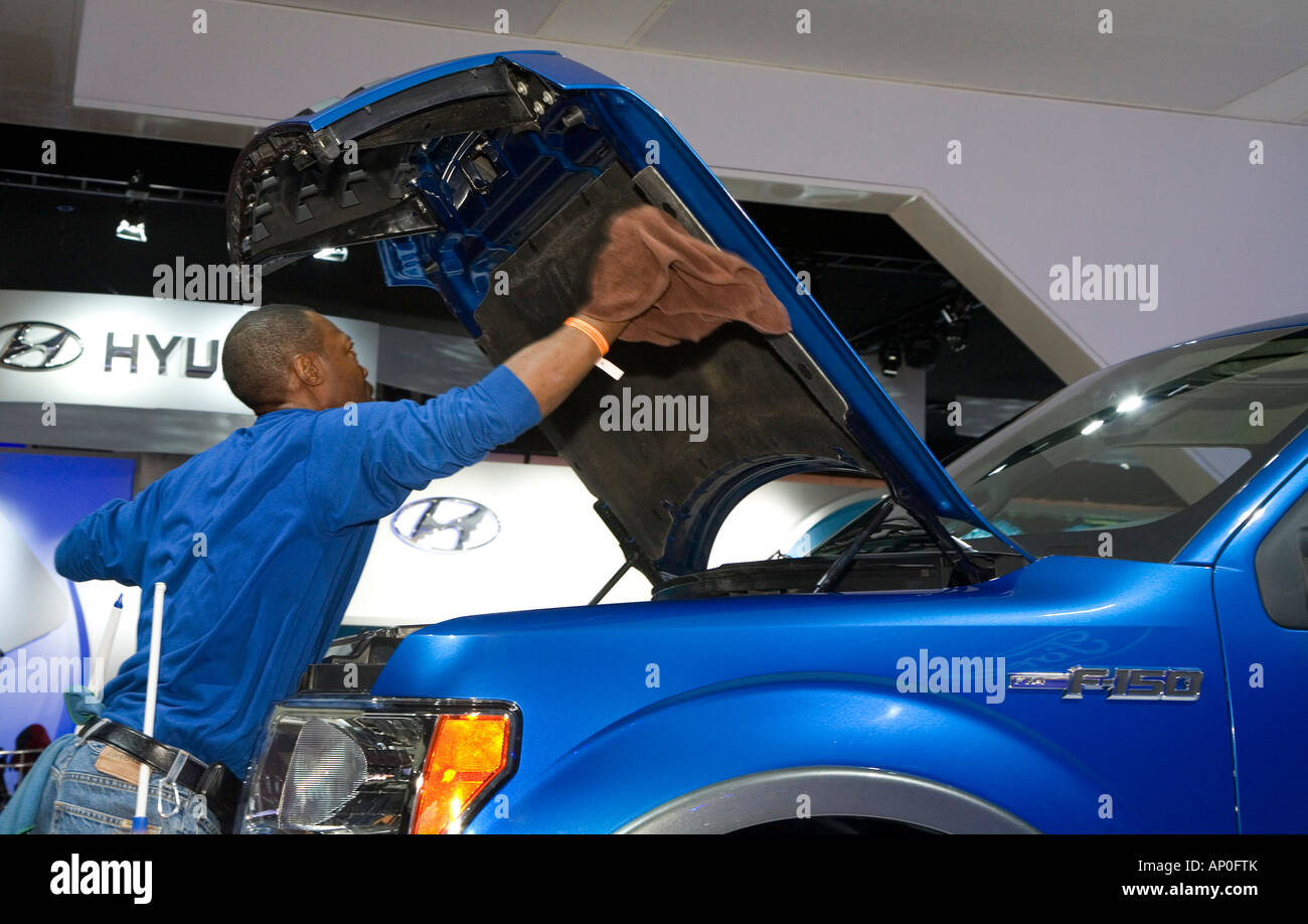 Worker polishes Ford F150 pickup truck at Detroit auto show Stock Photo ...