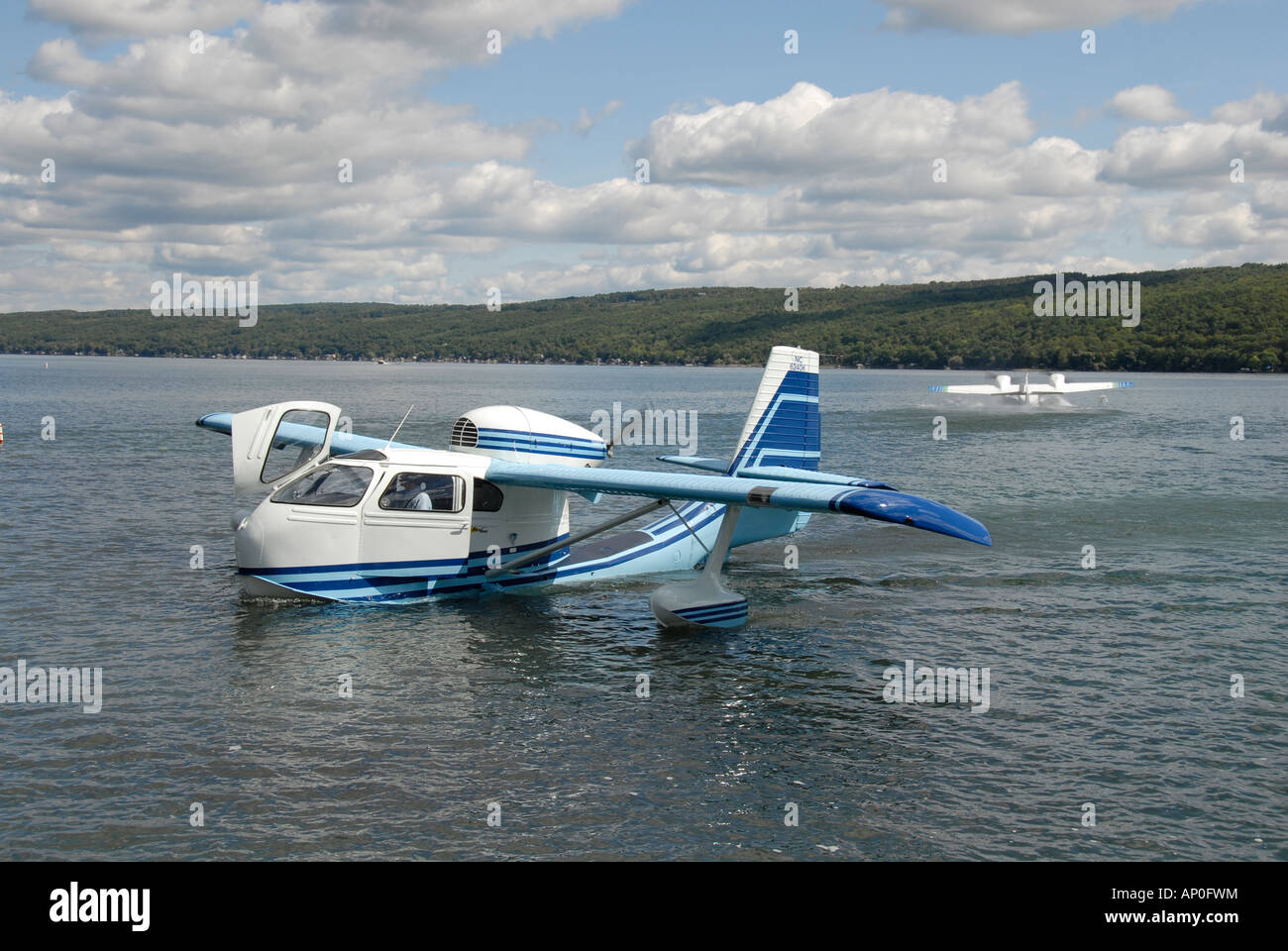 Amphibian plane just landed in lake Stock Photo - Alamy