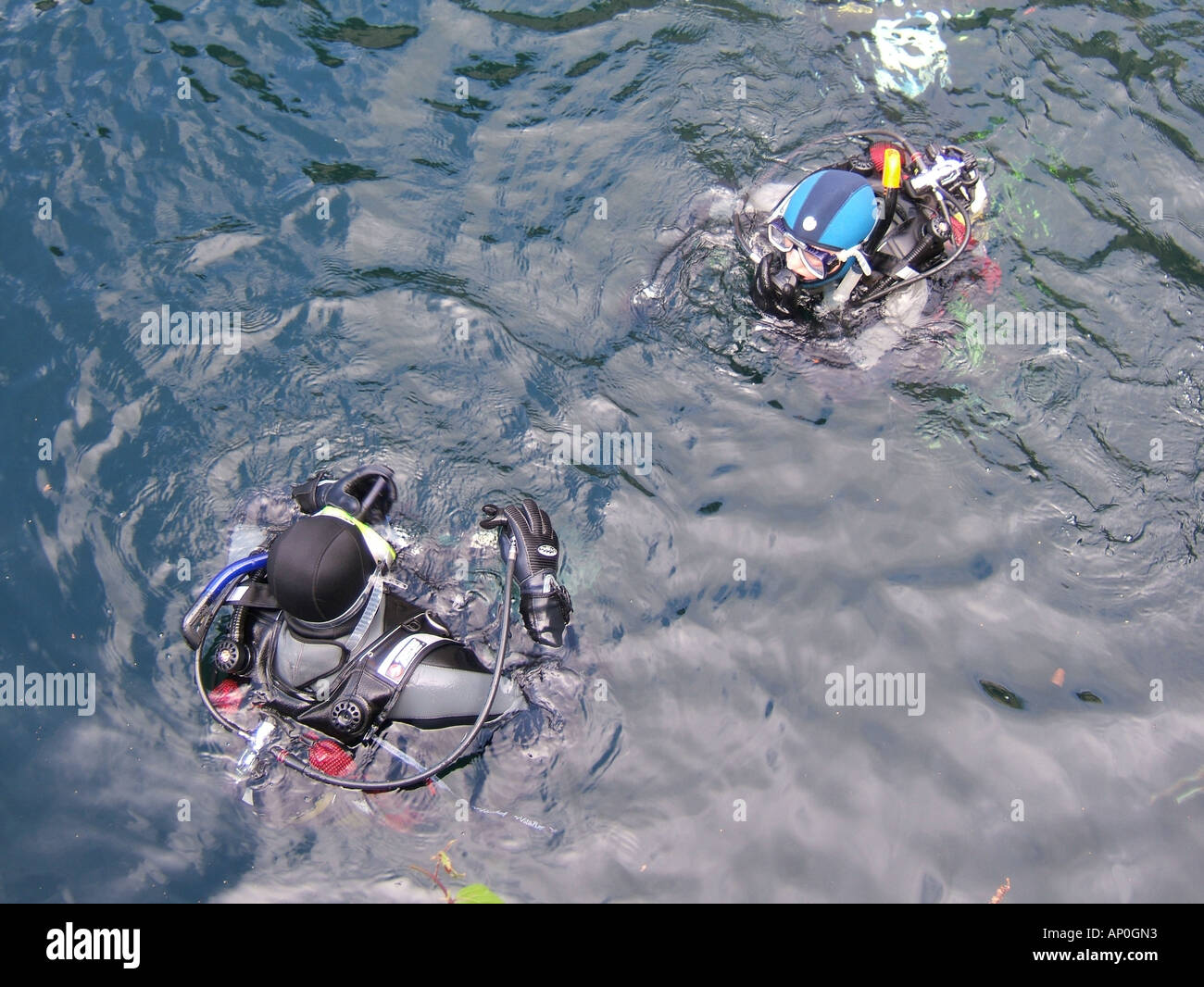 two divers in cold water lake Stock Photo - Alamy
