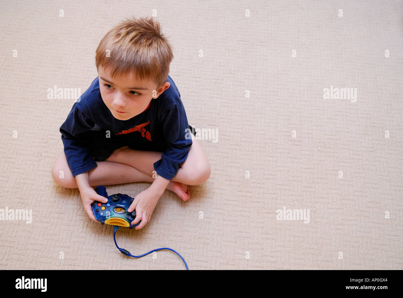 young boy playing on computer game console Stock Photo - Alamy